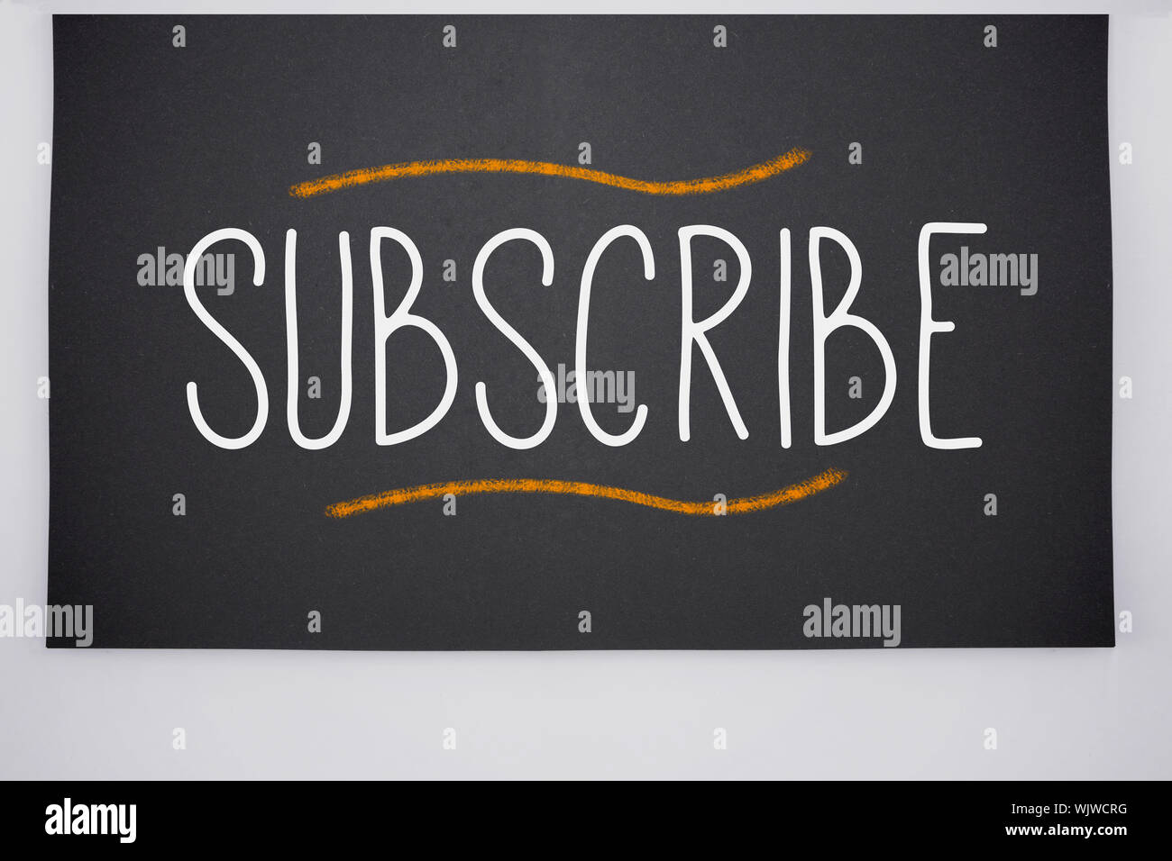 The word subscribe written on big blackboard Stock Photo - Alamy