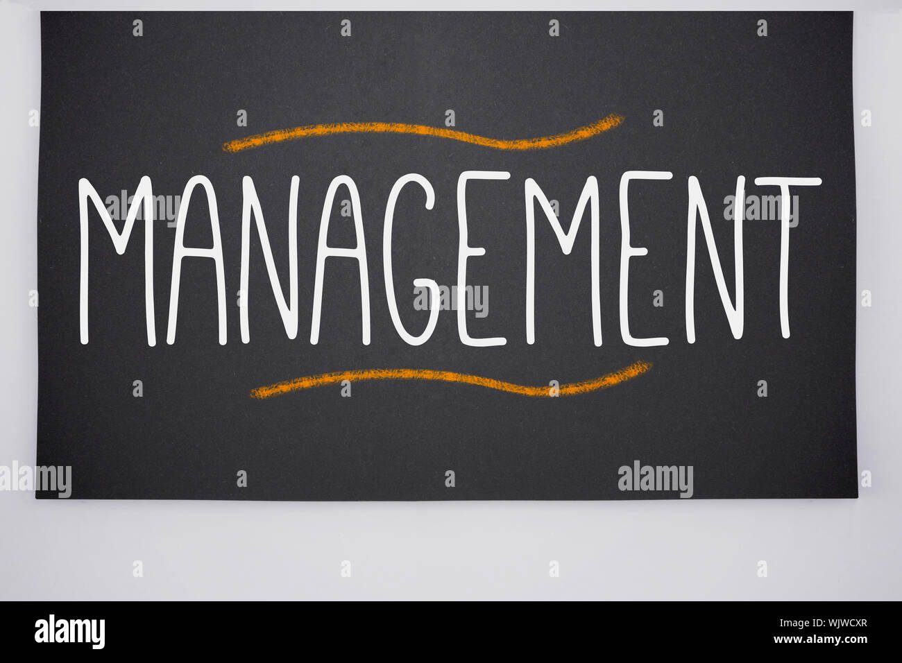 The word management written on big blackboard Stock Photo - Alamy