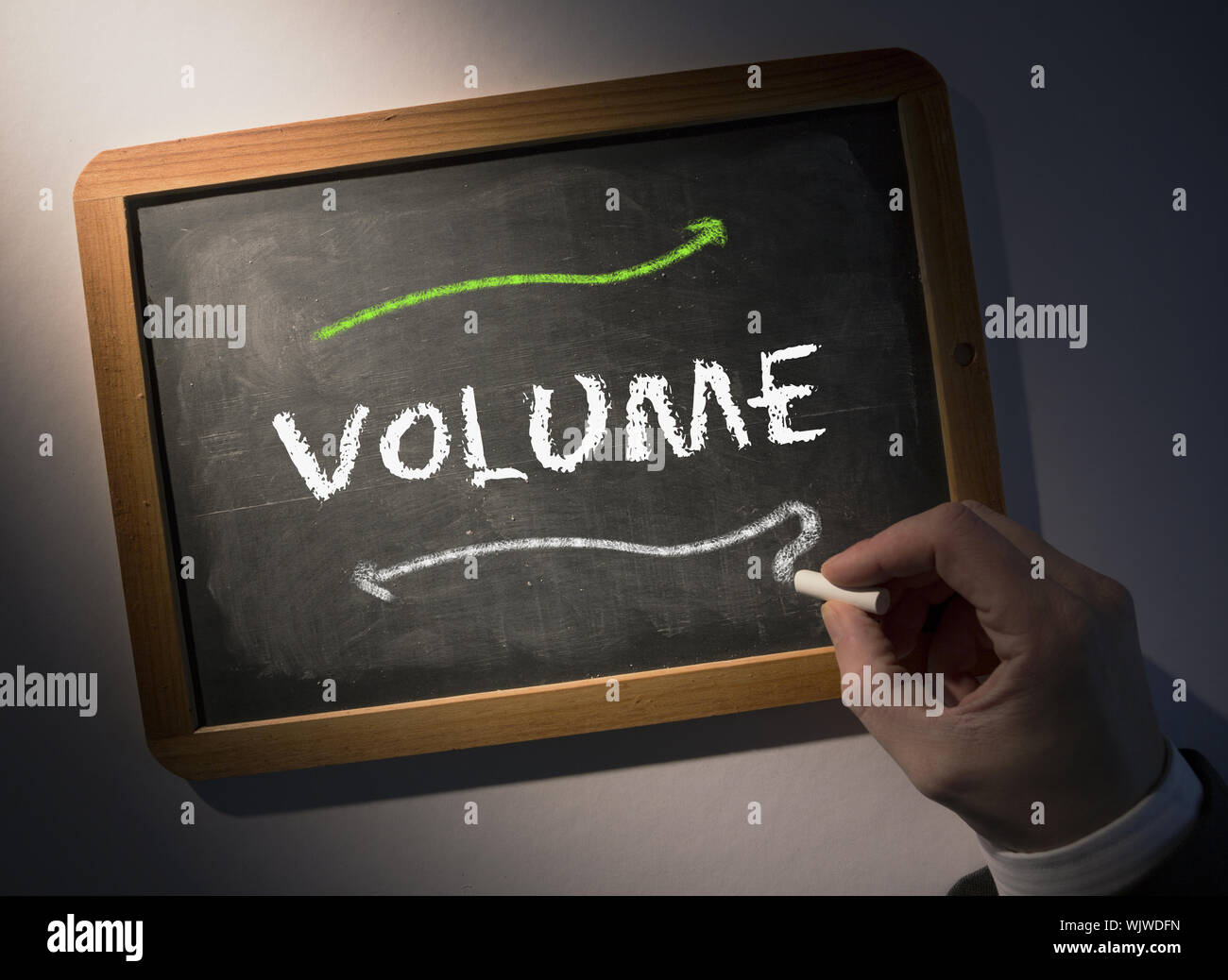 Hand writing the word volume on black chalkboard Stock Photo - Alamy