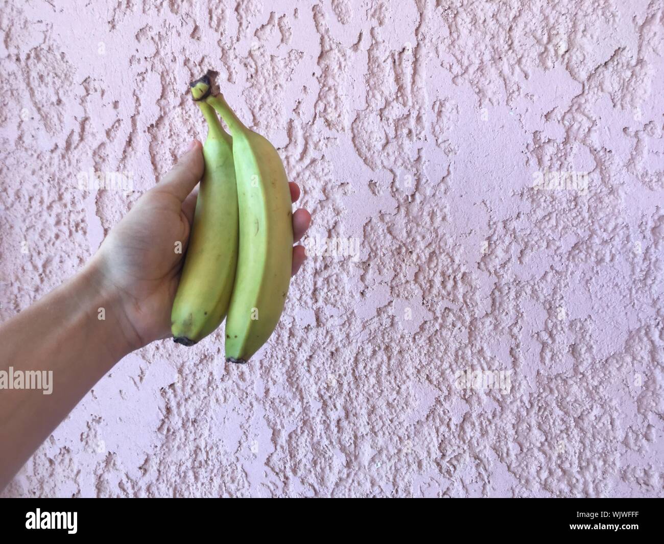 Hand bananas hi-res stock photography and images - Alamy