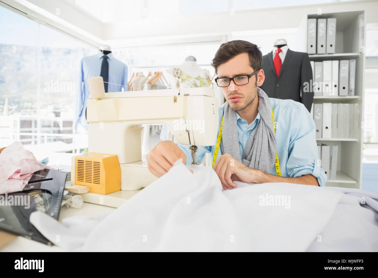 Man sitting in tailoring workshop hi-res stock photography and images ...