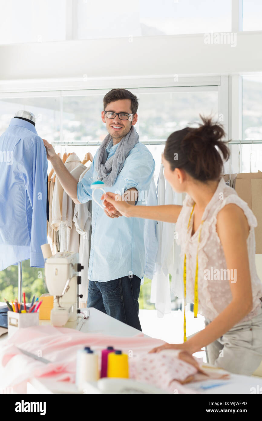 Male and female fashion designers at work in a studio Stock Photo - Alamy