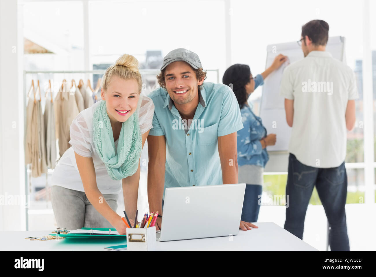 Group of fashion designers at work in a studio Stock Photo - Alamy