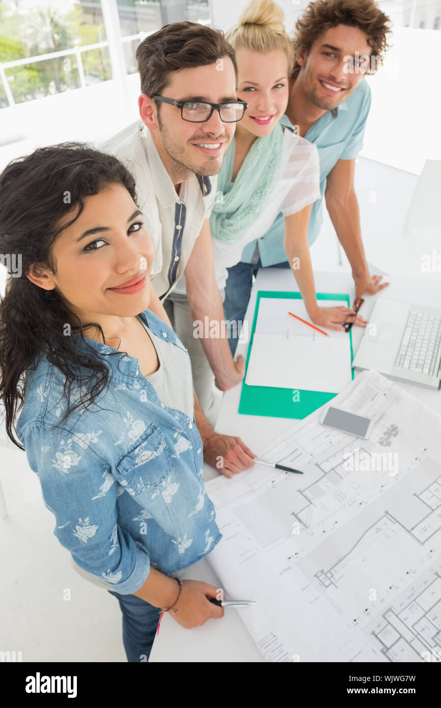 Group of fashion designers discussing designs in a studio Stock Photo ...