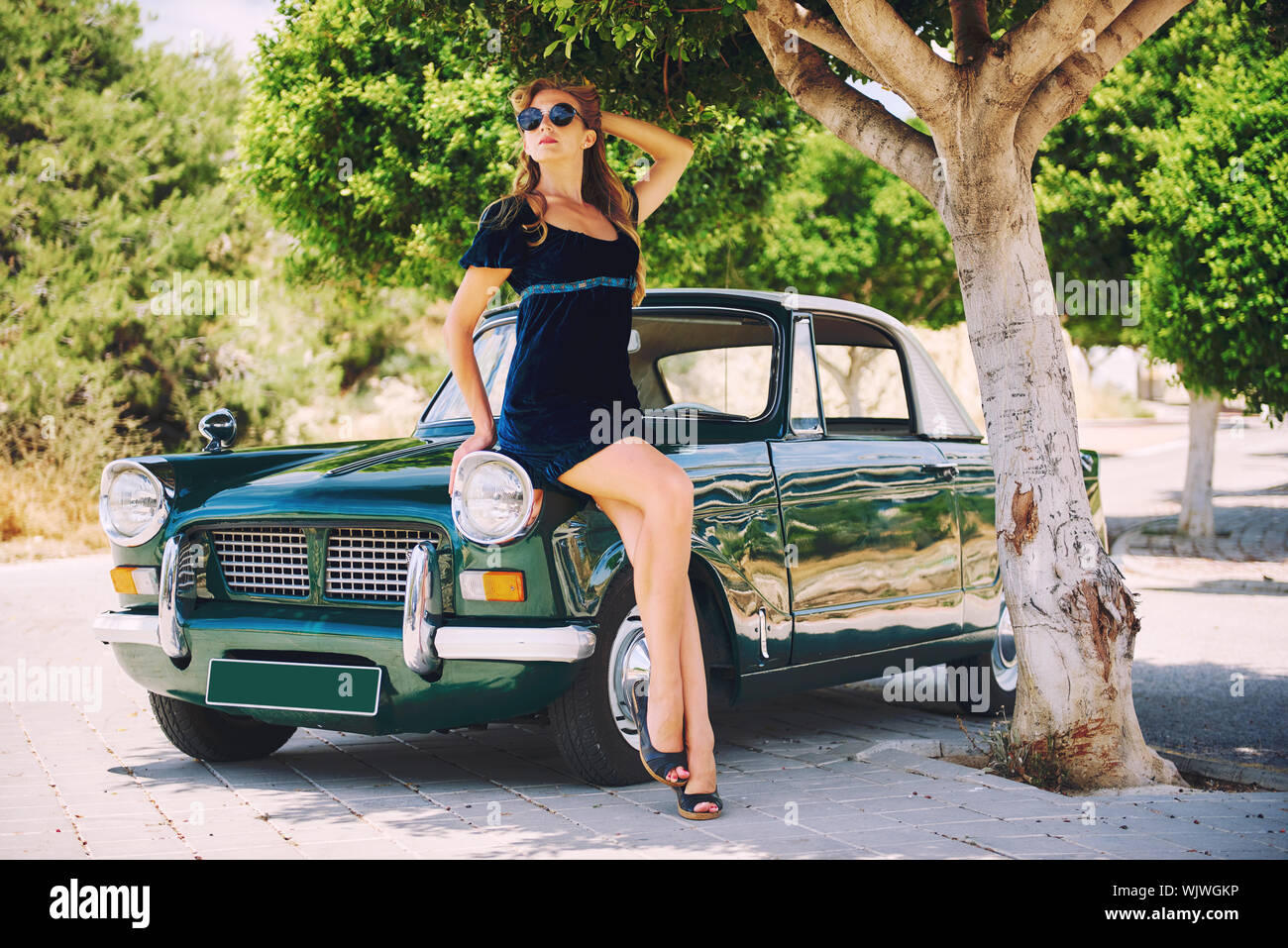 Model posing with car hi-res stock photography and images - Alamy