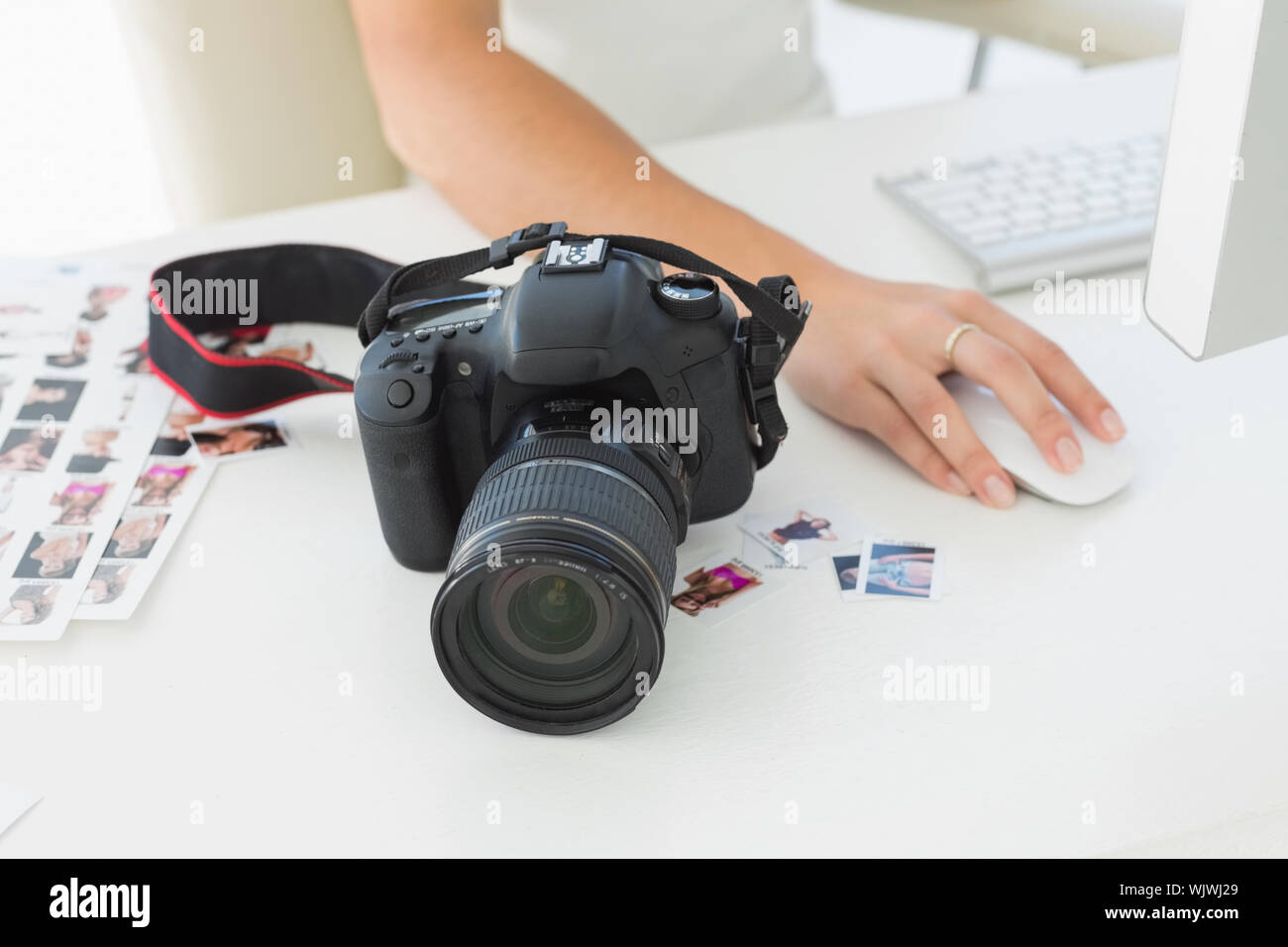 Digital camera on photographers desk in creative office Stock Photo - Alamy