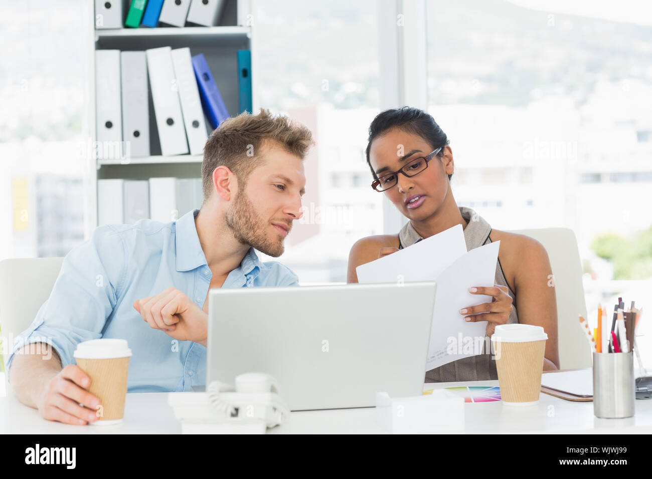 Creative partners working together using hi-res stock photography and ...