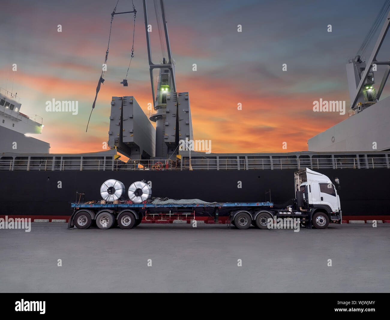 Cargo ship sunset land hi-res stock photography and images - Alamy