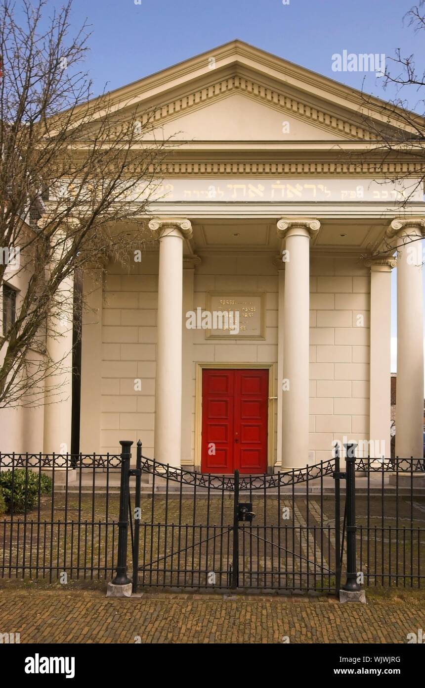 Old synagogue in greek (ionic) style behind a closed metal gate Stock ...