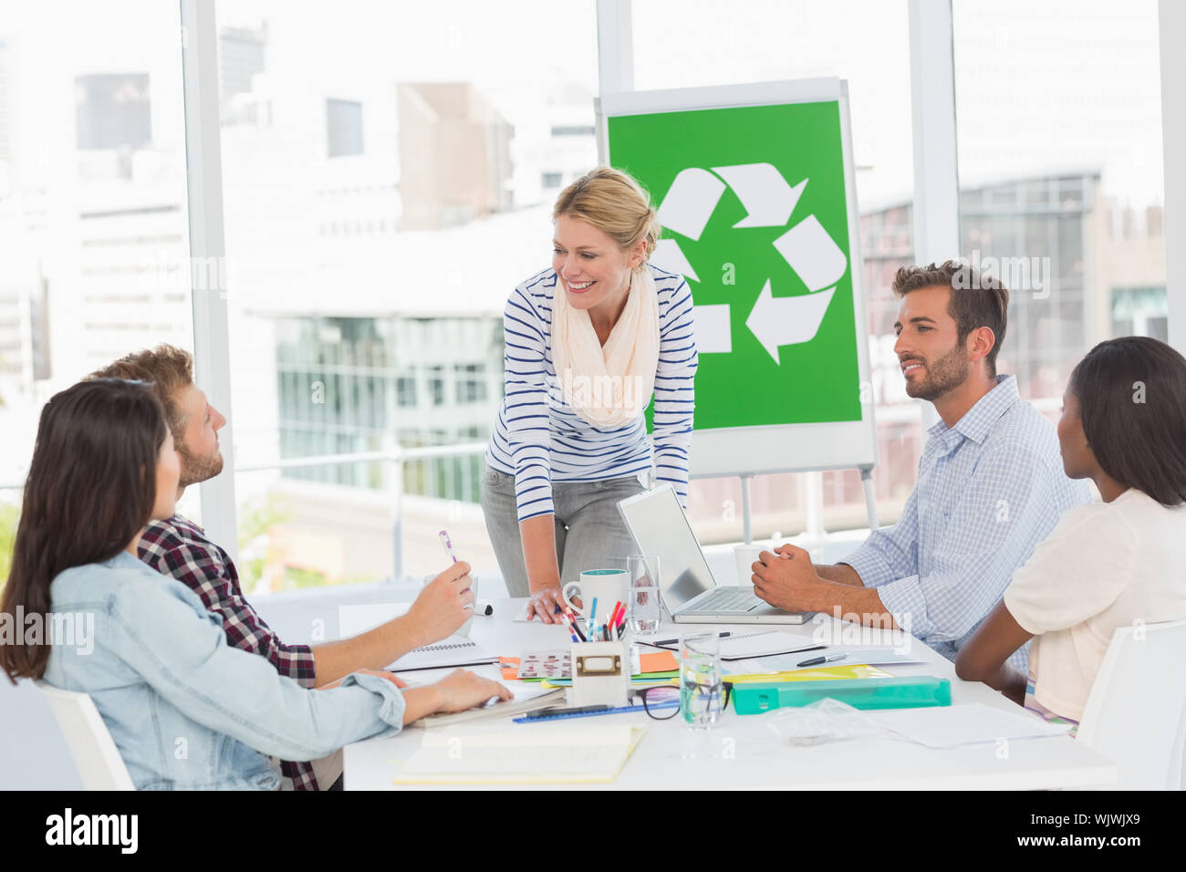 Colleagues recycling in office hi-res stock photography and images - Alamy