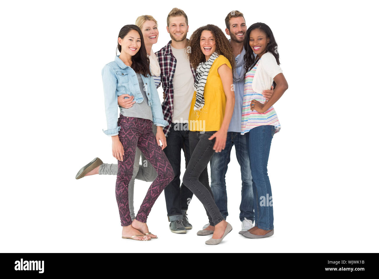 Happy group of young friends smiling at camera on white background ...