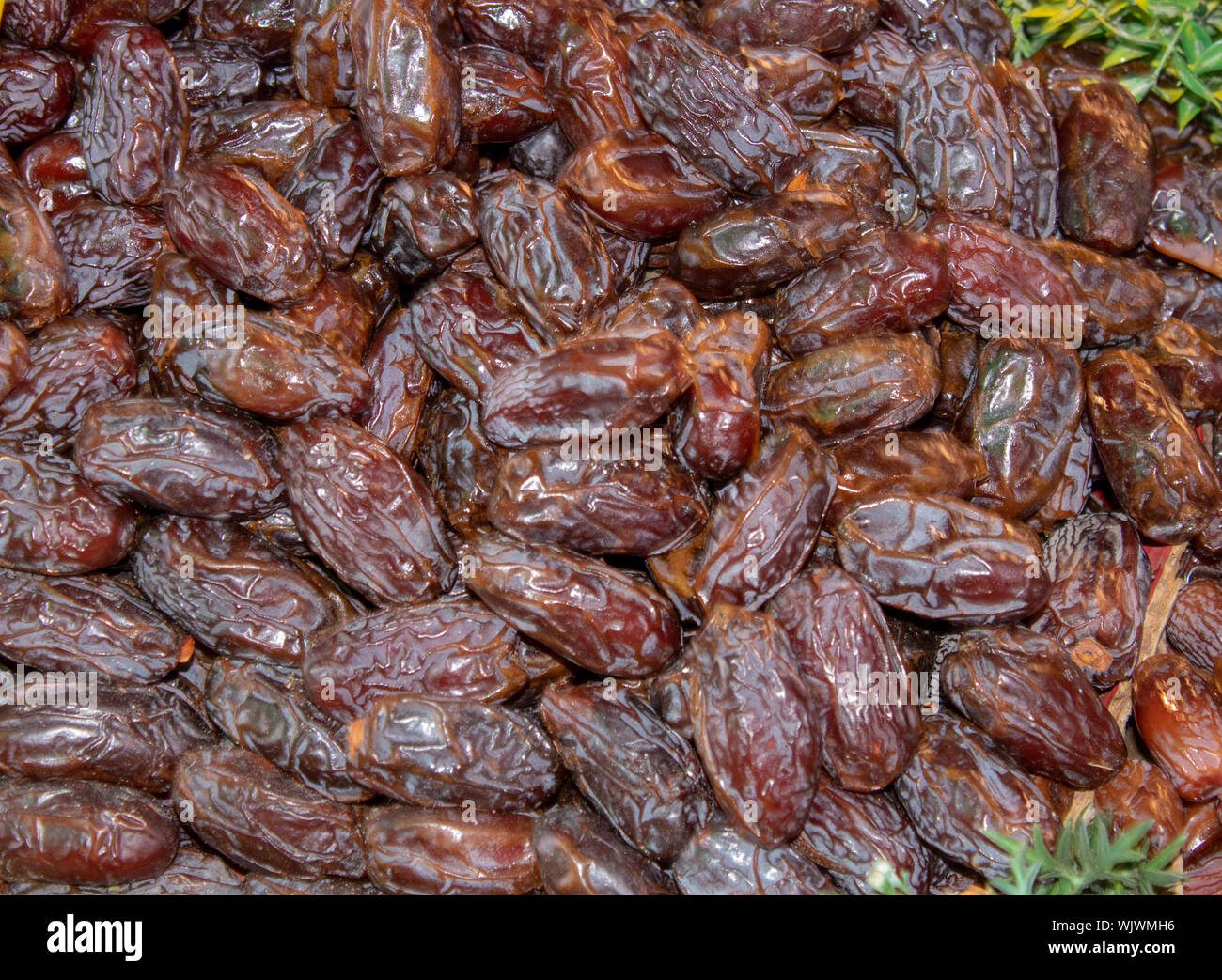 Persimmon fruit close-up. With dark brown color Stock Photo - Alamy