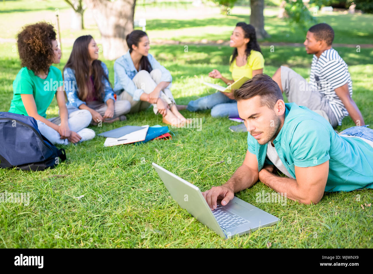 Group of students studying at college campus Stock Photo - Alamy