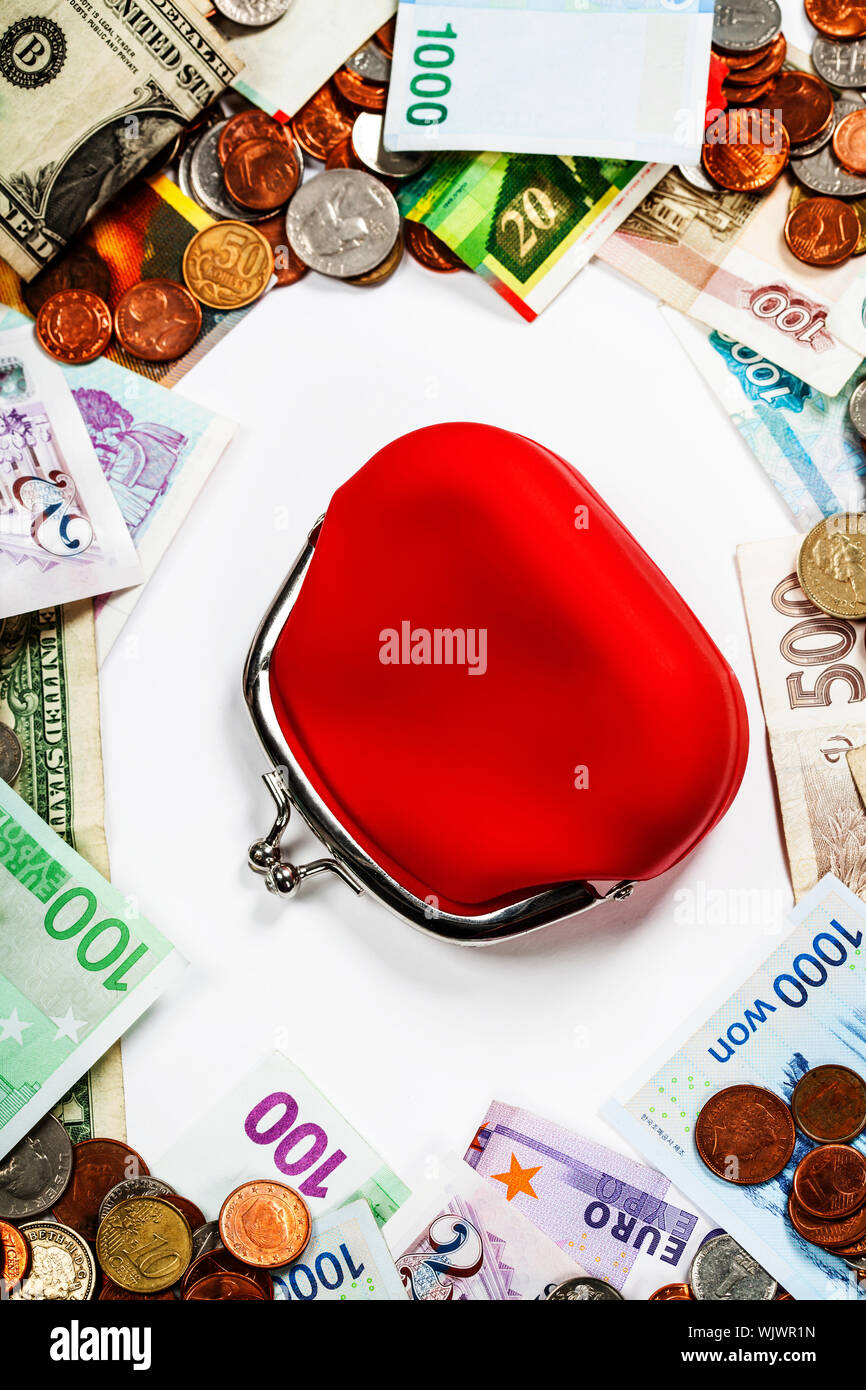 Foreign coins and banknotes frame with red purse. Money background ...
