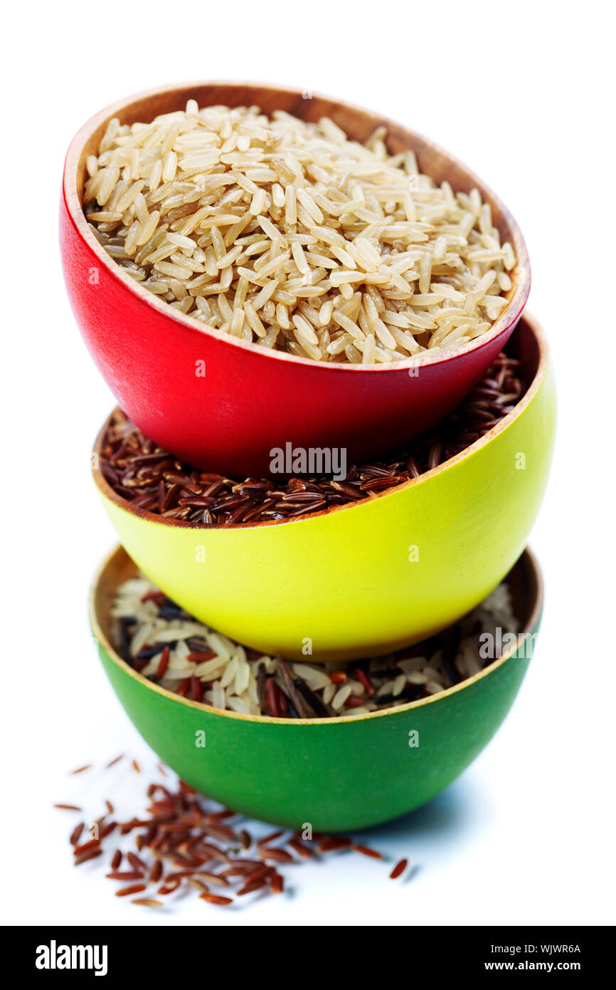 Three bowls with different types of rice on white background Stock ...