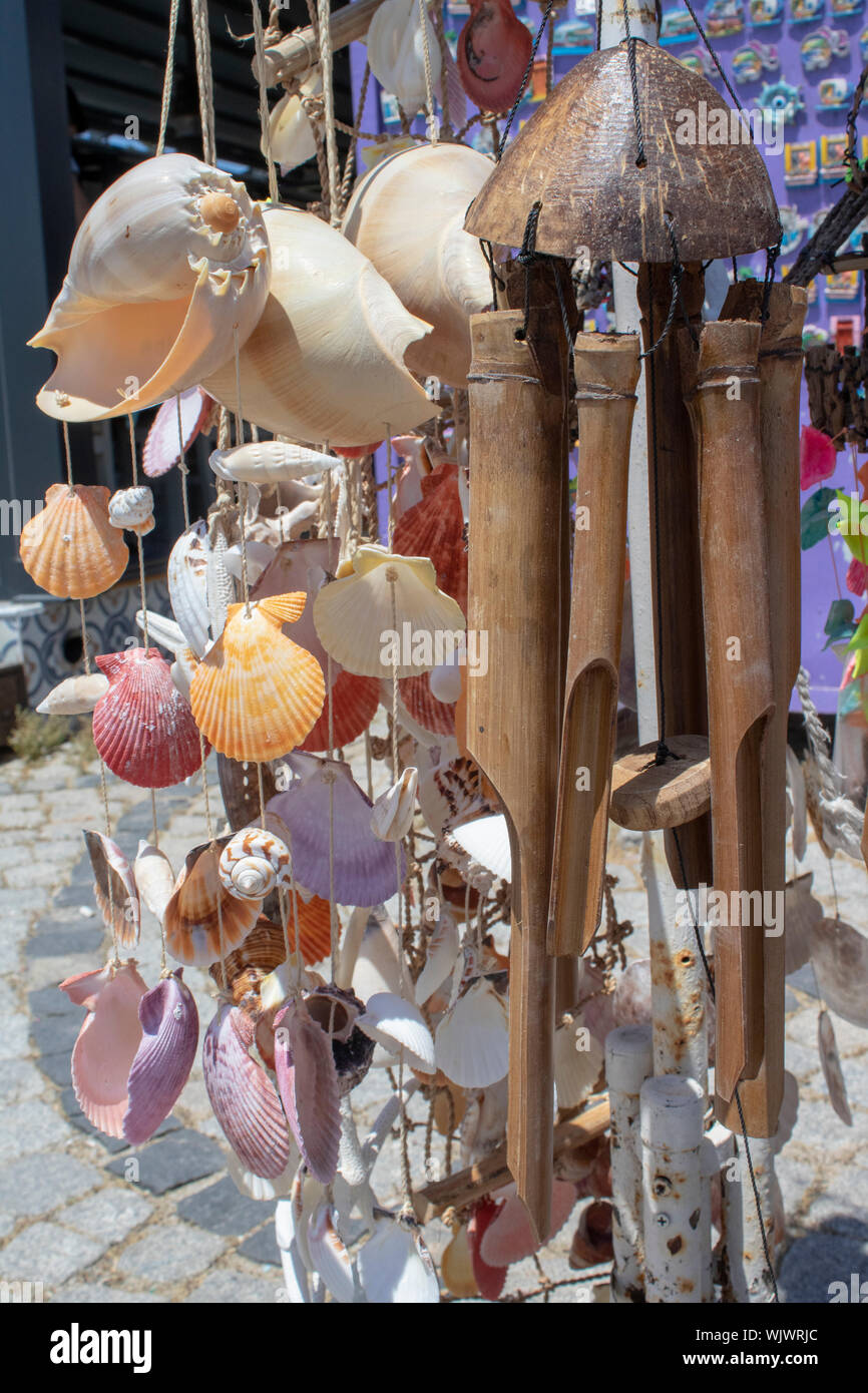 Hanging wooden wind bell. Close-up. Blurred background Stock Photo - Alamy