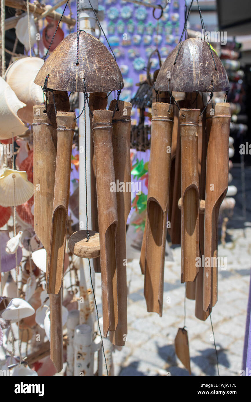 Hanging wooden wind bell. Close-up. Blurred background Stock Photo - Alamy