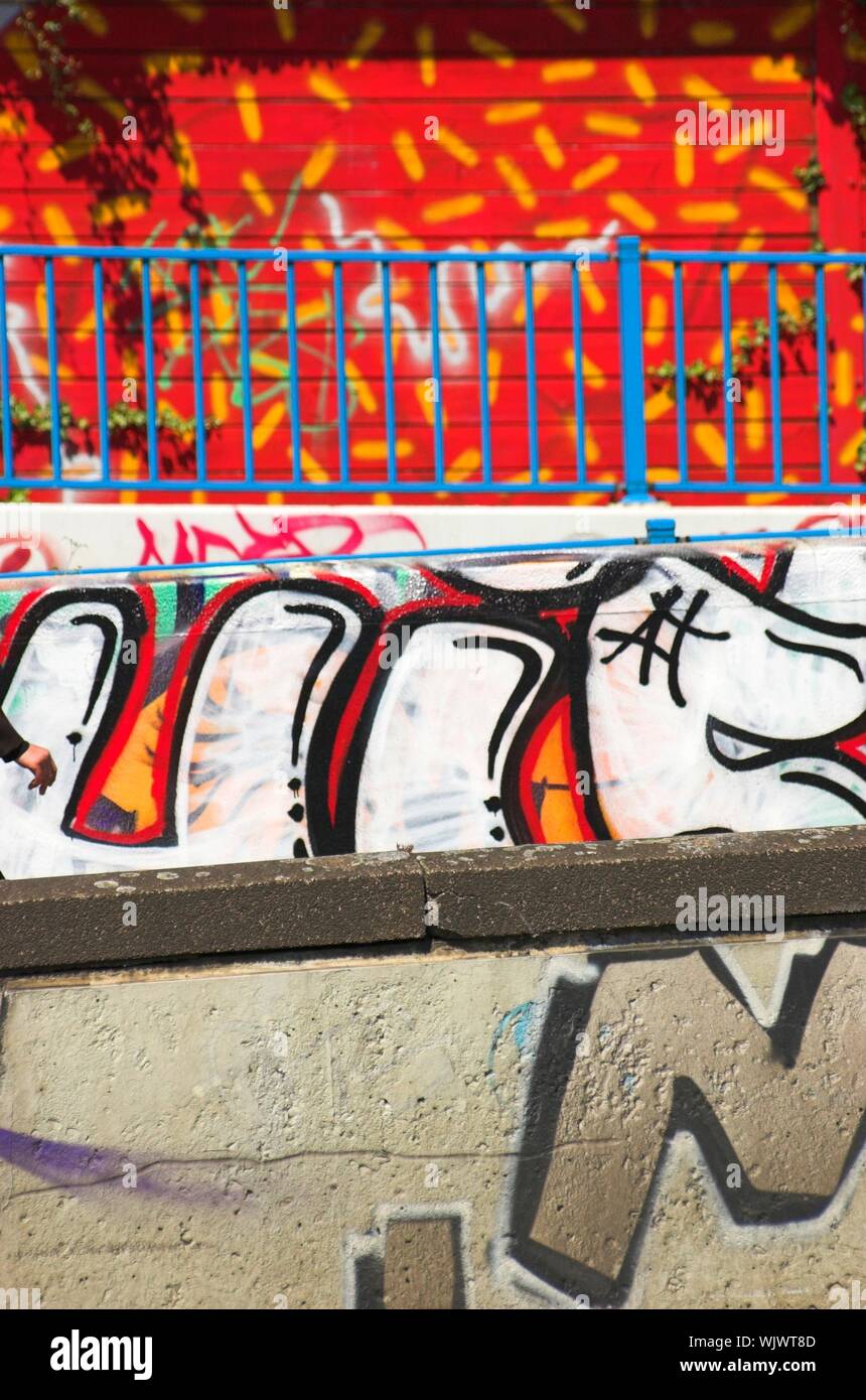 Grafitti on a wall of a pedestrian bridge crossing Stock Photo - Alamy