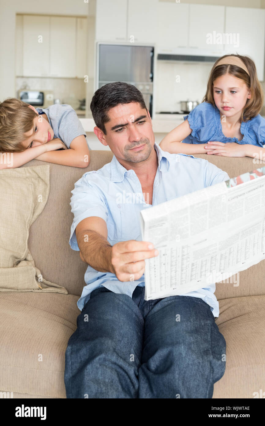 Daughter Looking Father Reading Newspaper High Resolution Stock ...
