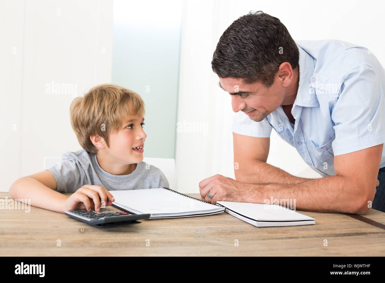 Father homework standing hi-res stock photography and images - Alamy