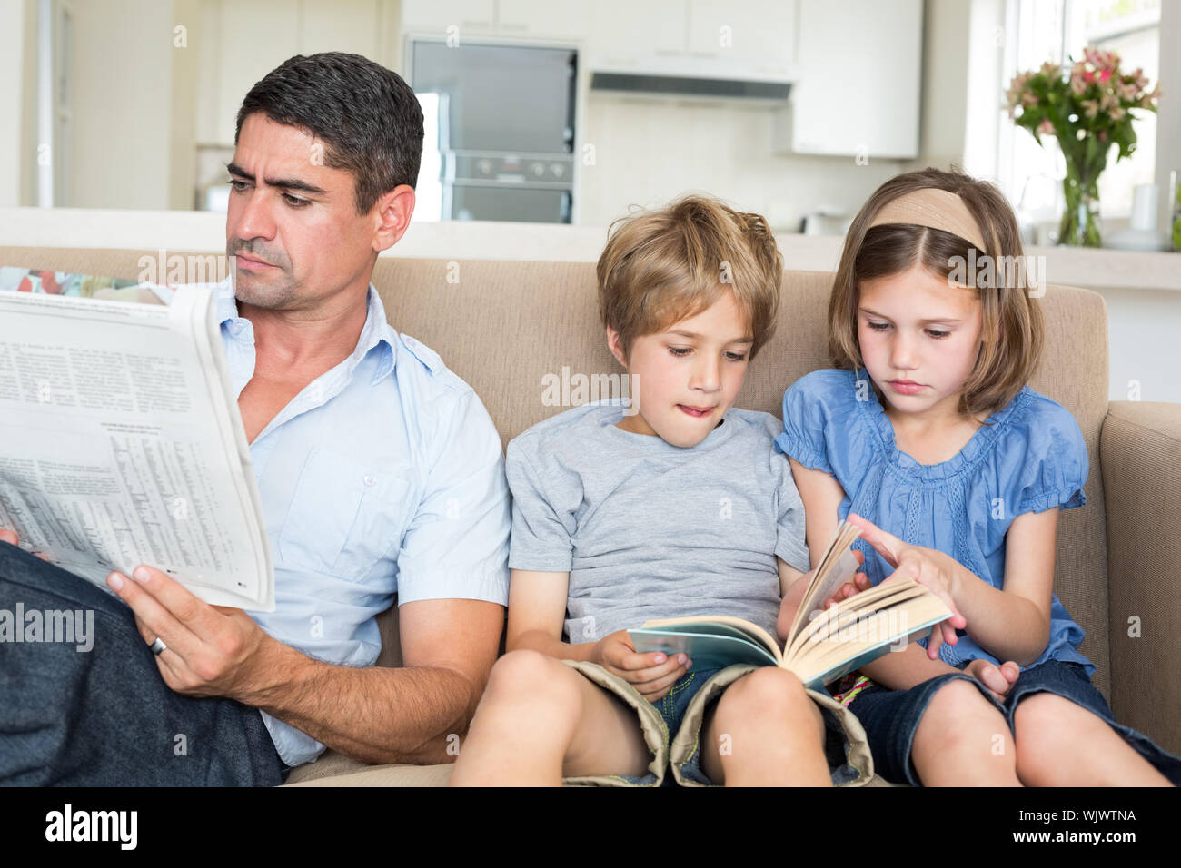 Child children reading newspaper hi-res stock photography and images - Alamy