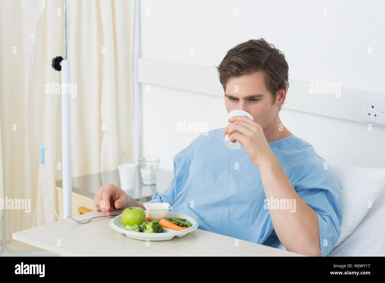 Male patient eating food in the hospital hi-res stock photography and ...