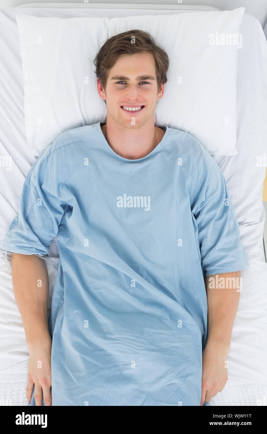 Overhead view of happy male patient lying in hospital bed Stock Photo ...