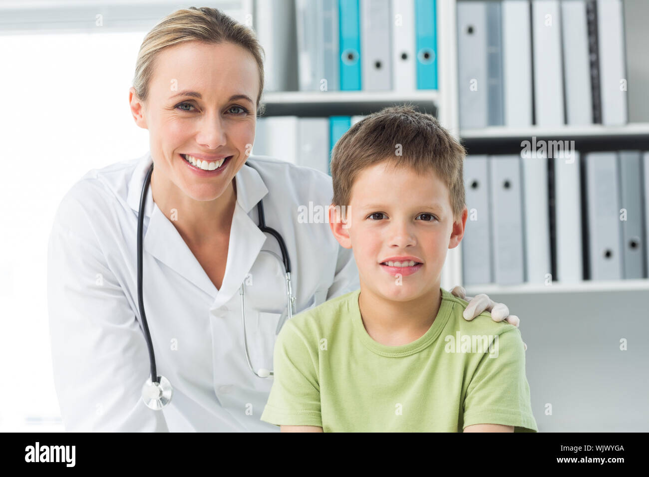 Portrait of friendly female doctor with boy in clinic Stock Photo - Alamy