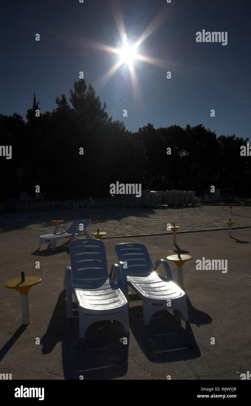 Plastic beach chair at the edge of a sea Stock Photo - Alamy