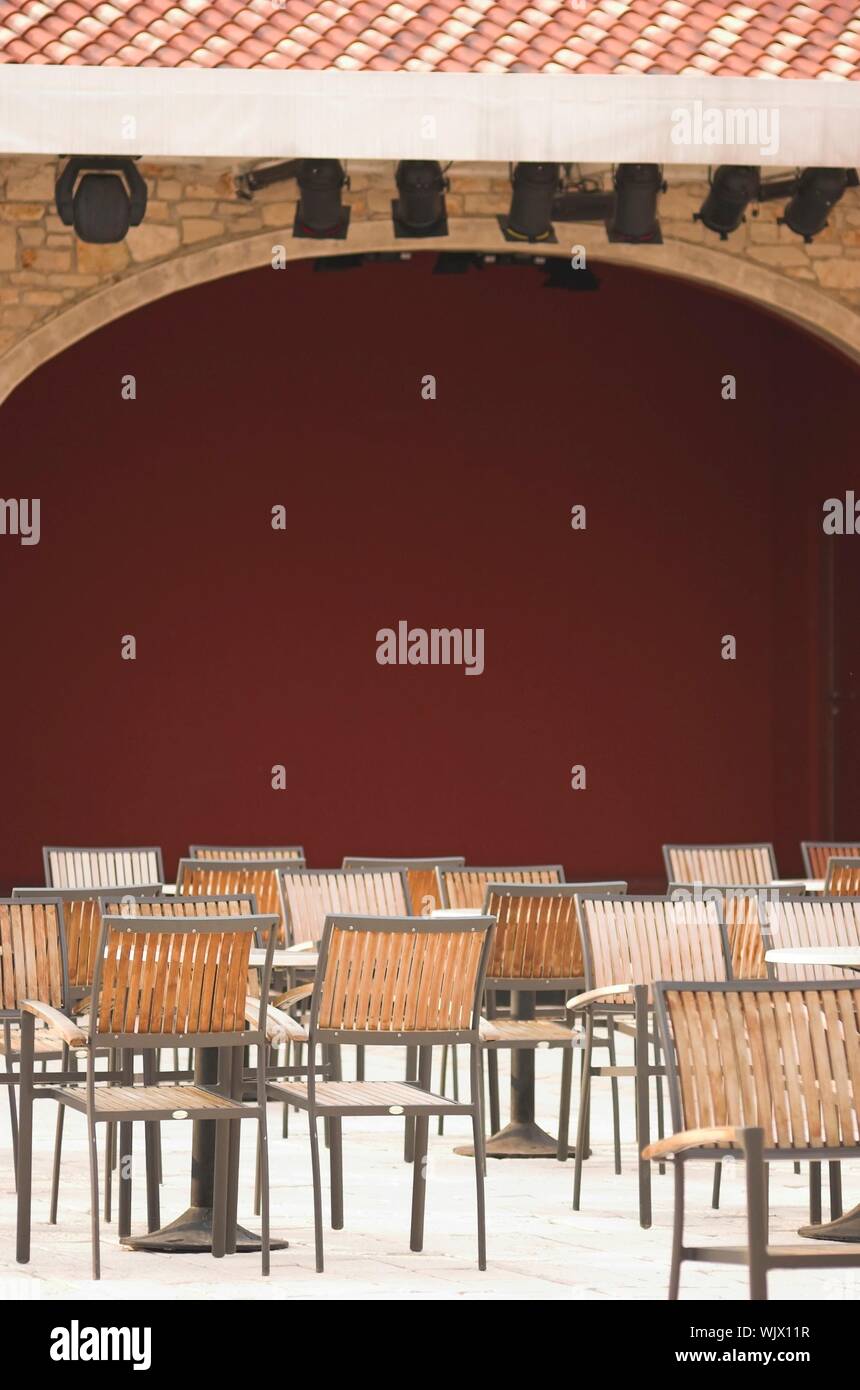 Cafe terrace filled with chairs next to a theatre scene Stock Photo - Alamy