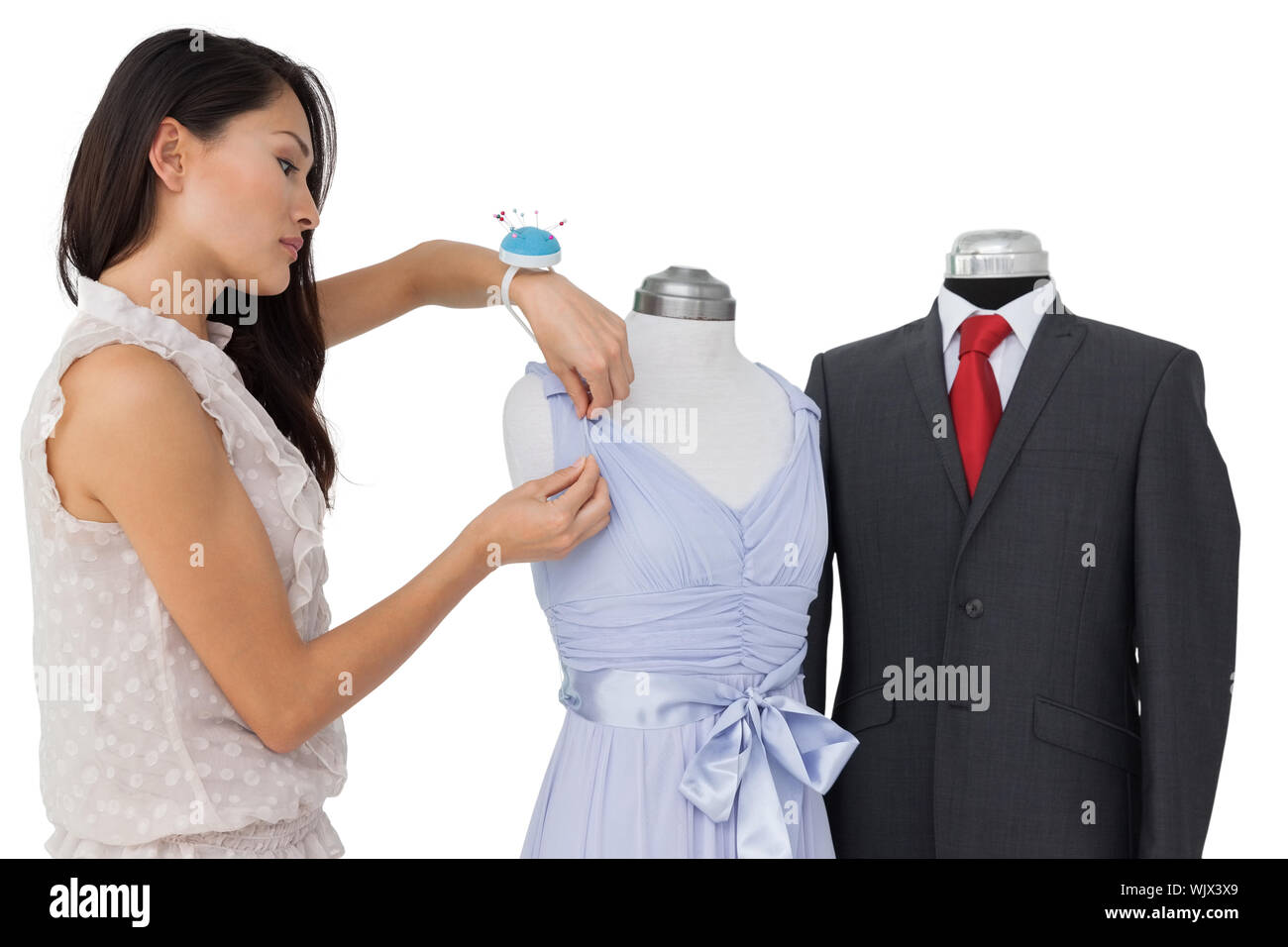 Female fashion designer and mannequins isolated on white background ...