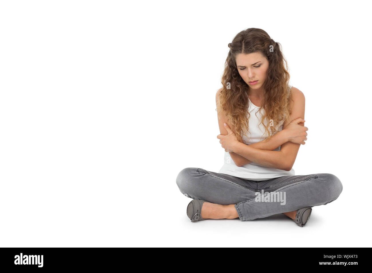 Full length of a sad young woman over white background Stock Photo - Alamy