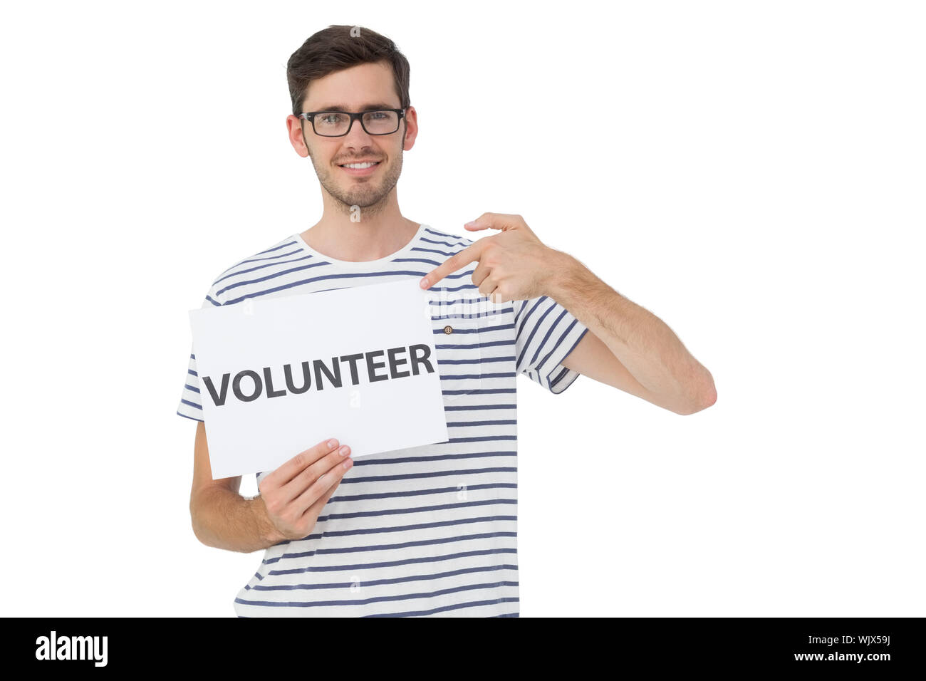 Portrait of a happy young man pointing at donation welcome note over ...