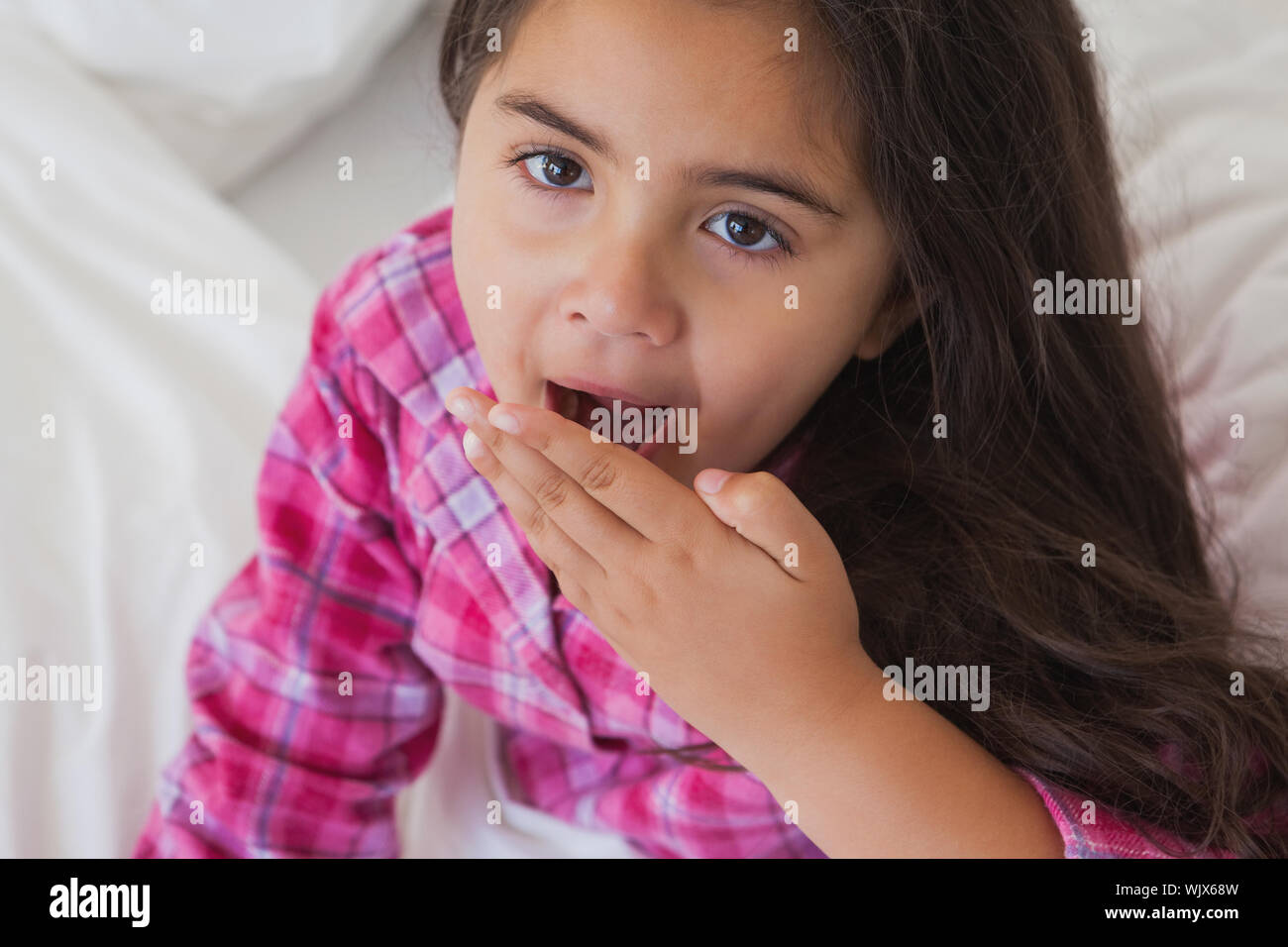 Girl yawning in bed hi-res stock photography and images - Alamy