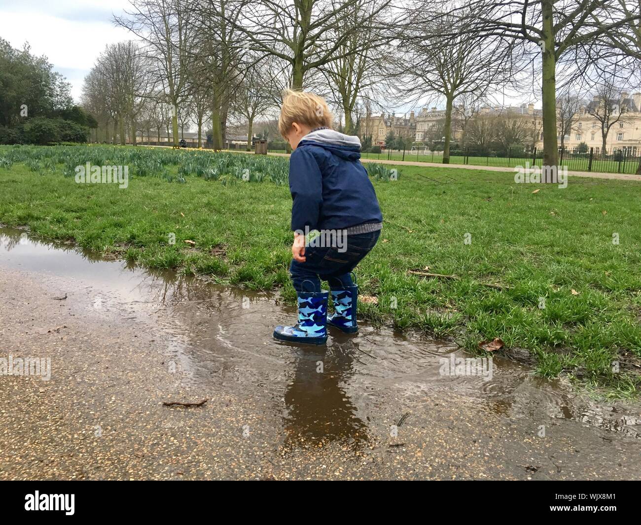 Boy Jumping In Puddle High Resolution Stock Photography and Images - Alamy
