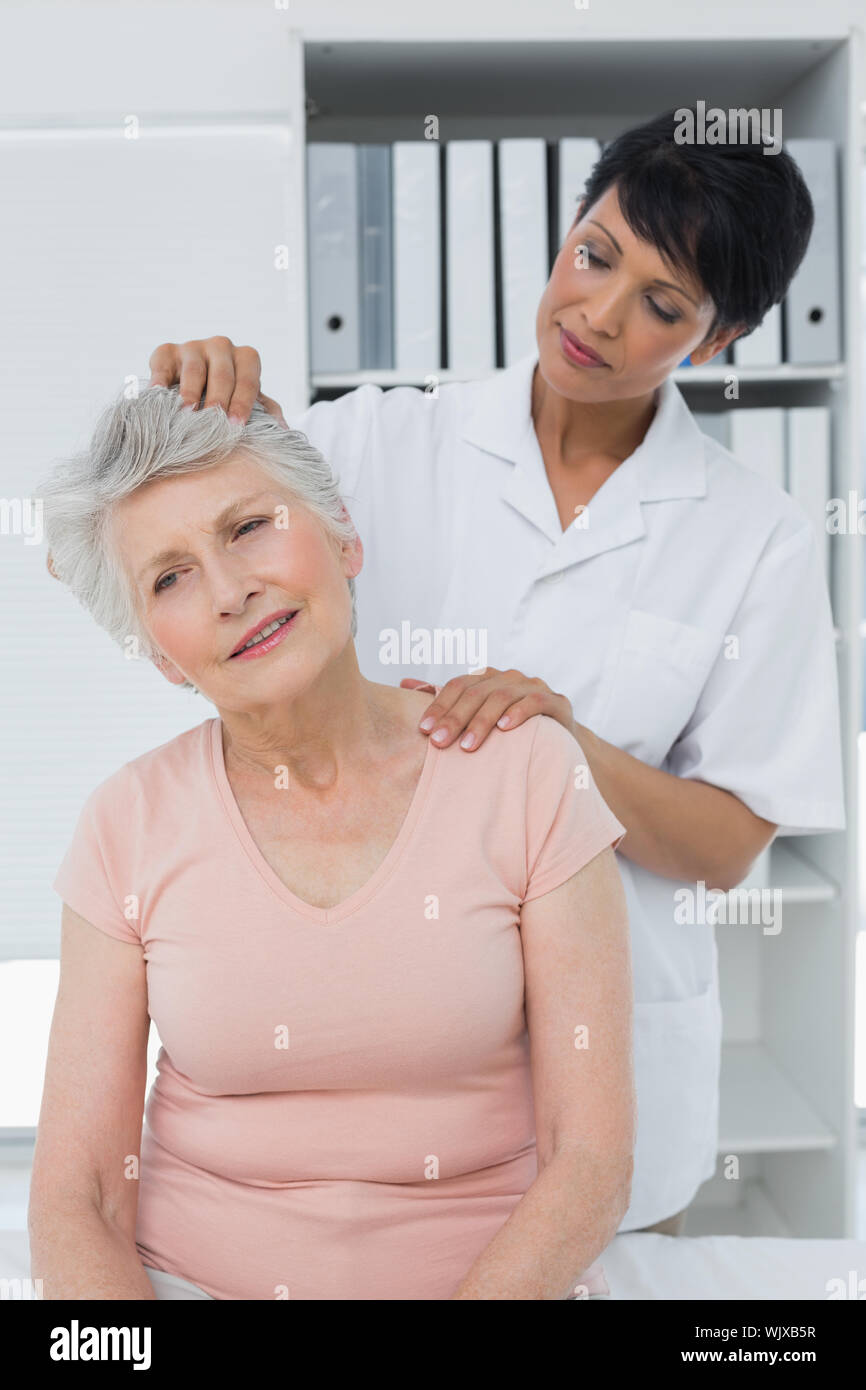 Chiropractor adjust patient hi-res stock photography and images - Alamy