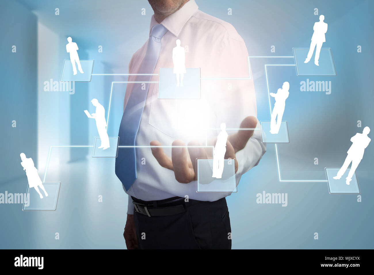 Digital composite of businessman presenting links between human ...