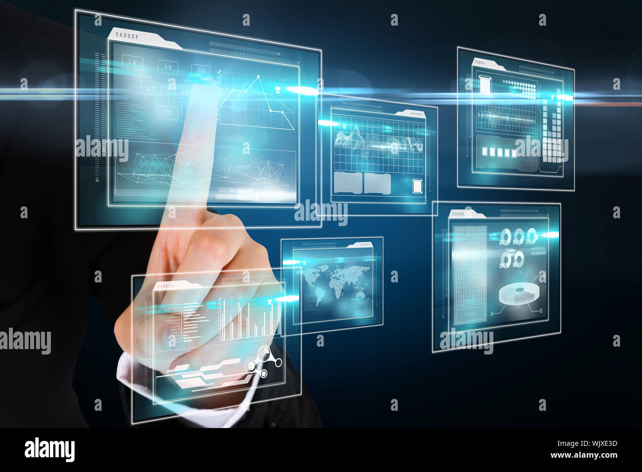 Digital composite of finger pointing to business interfaces Stock Photo ...
