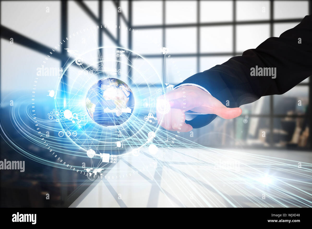 Digital composite of finger pointing to earth interface Stock Photo - Alamy