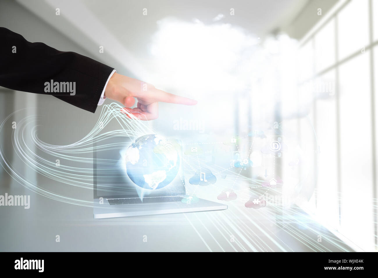 Digital composite of finger pointing to app icons with laptop Stock ...