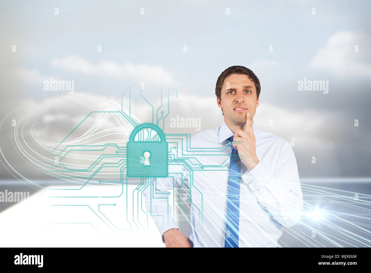 Digital composite of confused businessman with lock and circuit board ...