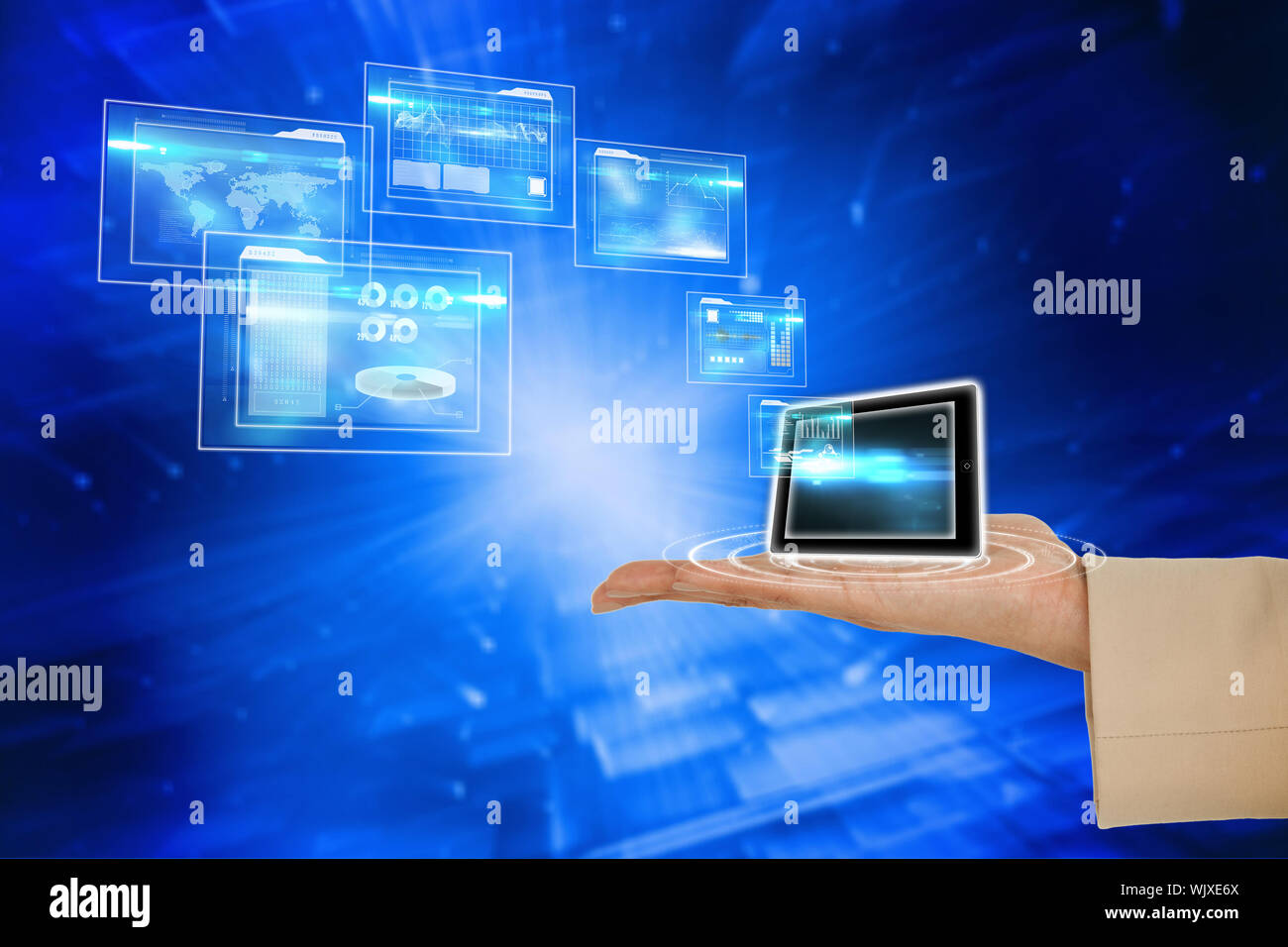 Digital composite of hand presenting tablet and interfaces Stock Photo ...