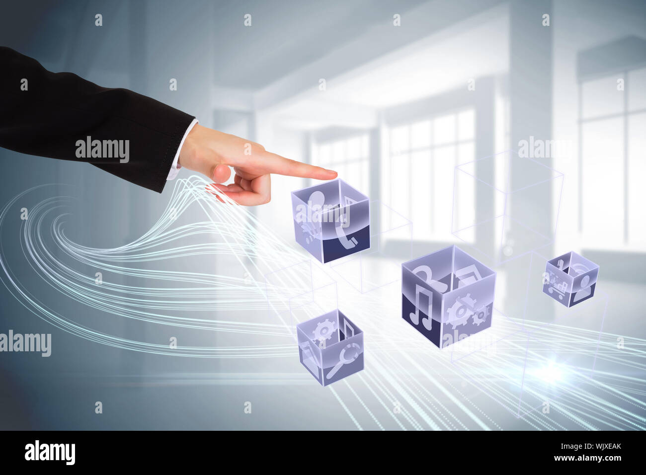 Digital composite of finger pointing to app icons on cubes Stock Photo ...