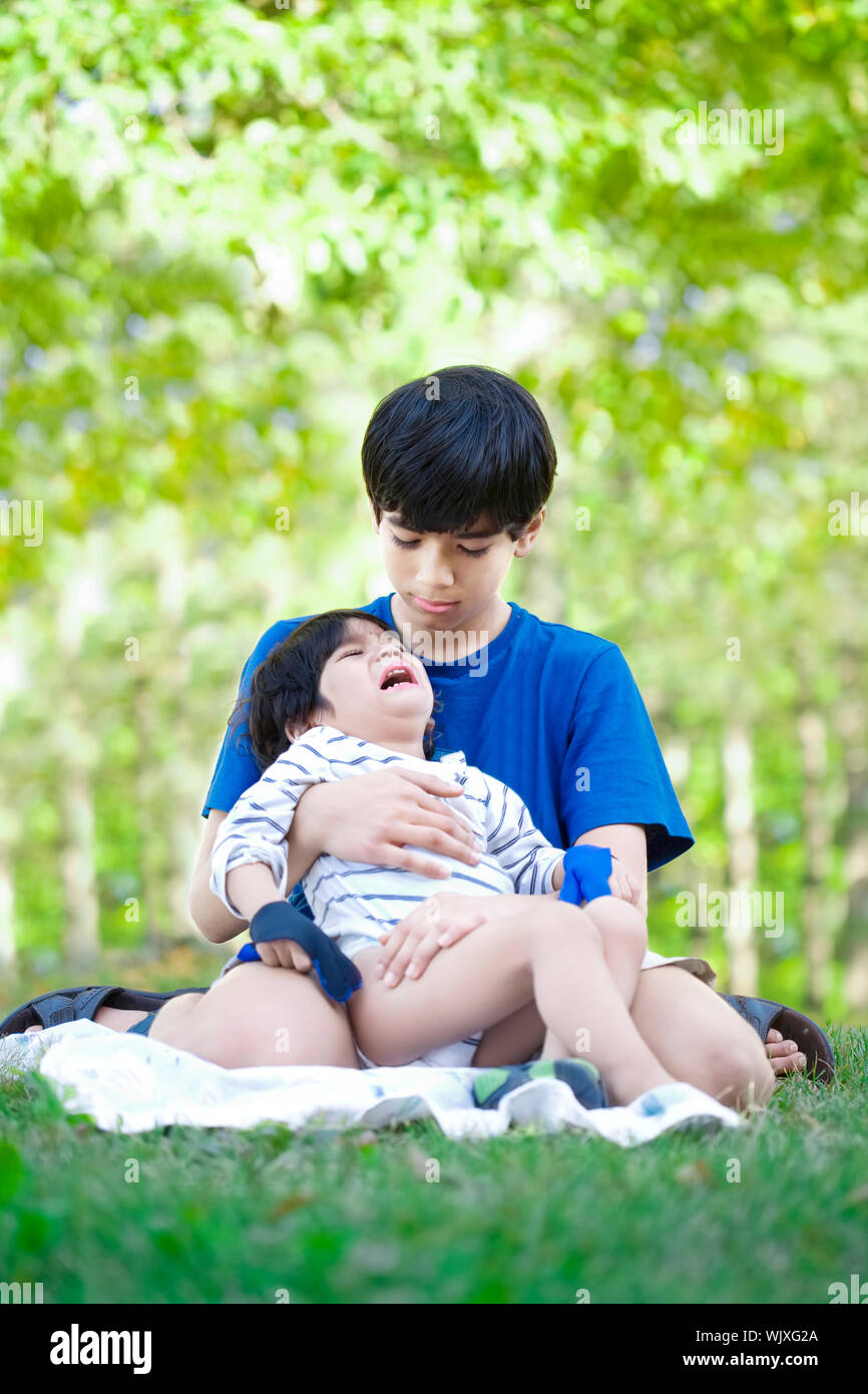 Sibling comforting hi-res stock photography and images - Alamy