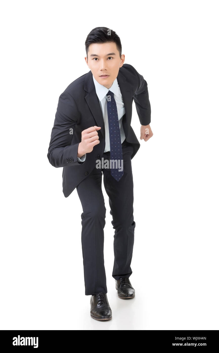 Attractive young business man running, full length portrait isolated on ...
