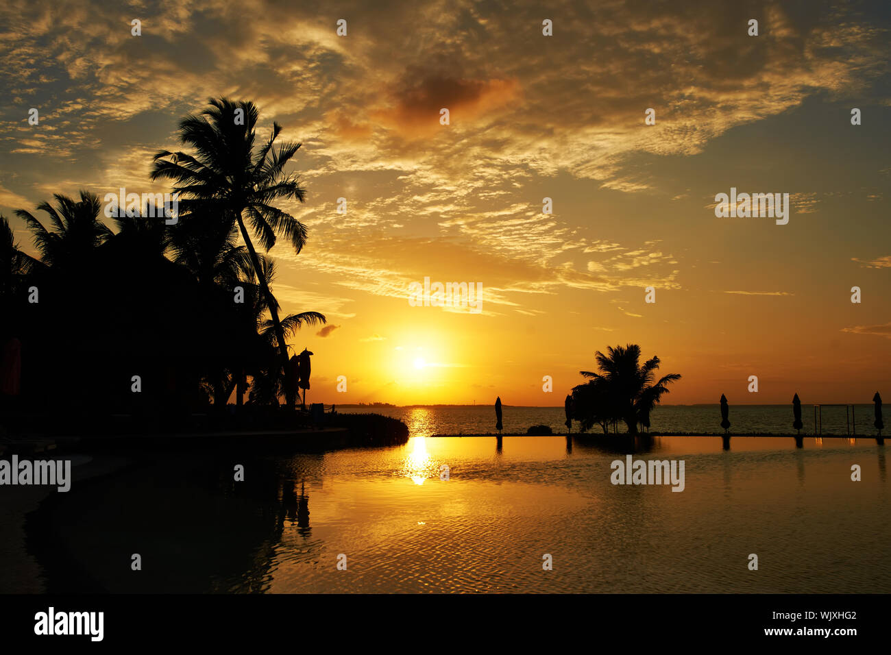 Beautiful sunset at Maldivian beach Stock Photo - Alamy