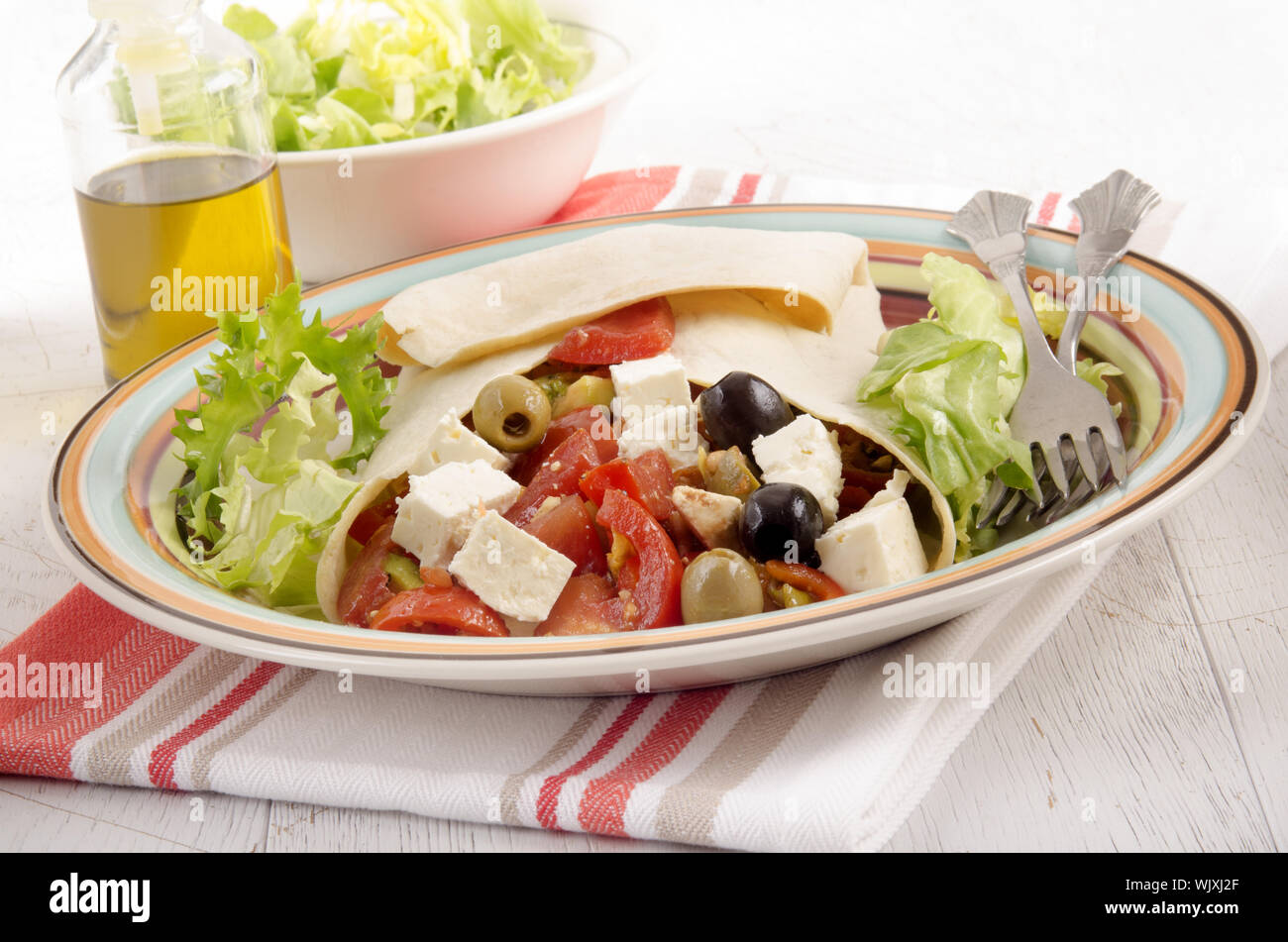 mediterranean style crepe with tomato, salad, goat cheese, green and ...