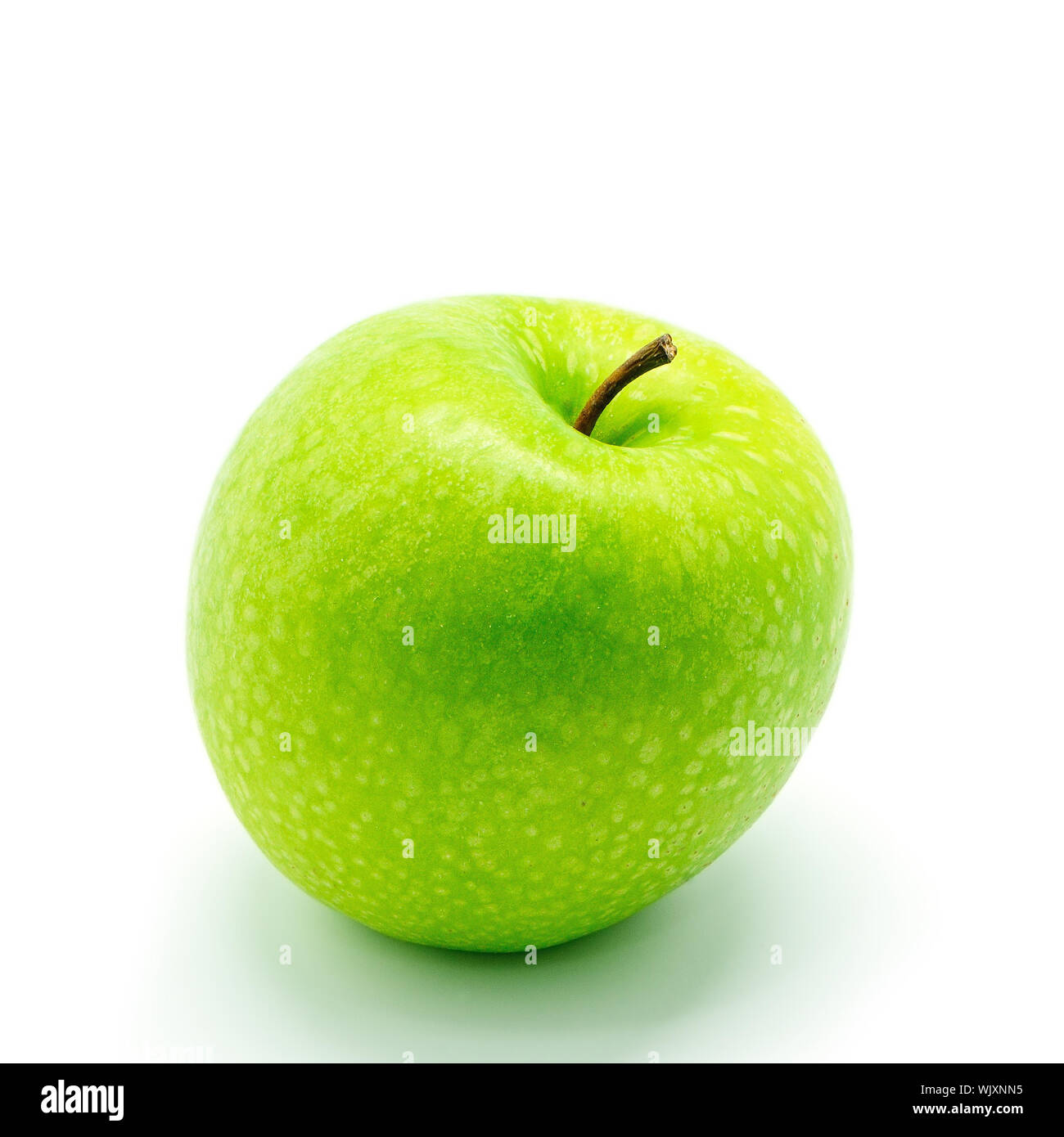 Green apple, isolated on a white background Stock Photo - Alamy