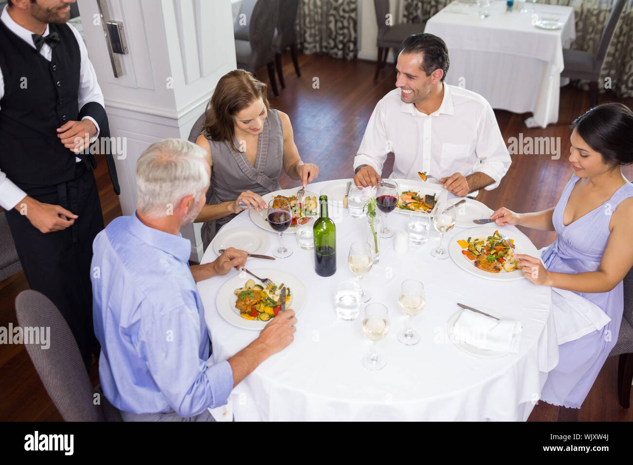 Business colleagues sitting around dining table in the restaurant Stock ...