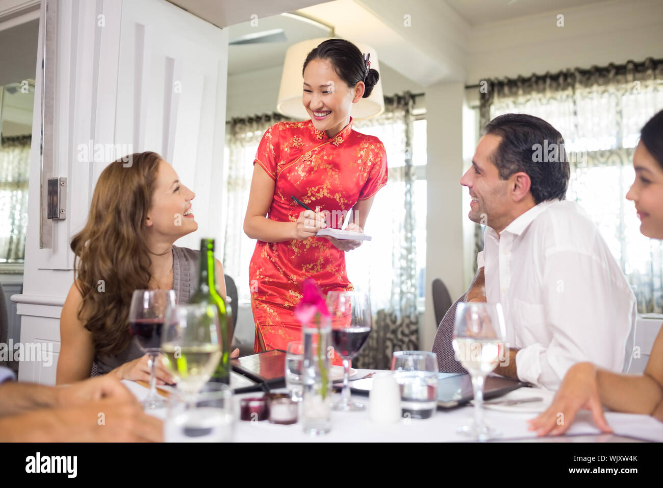 Business colleagues sitting around dining table in the restaurant Stock ...